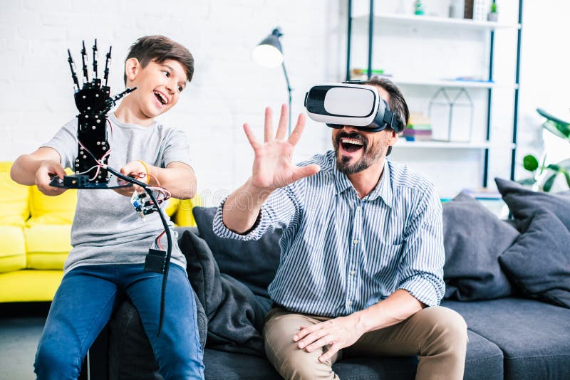 Cheerful Good Father Helping His Son with Engineering Project Stock ...