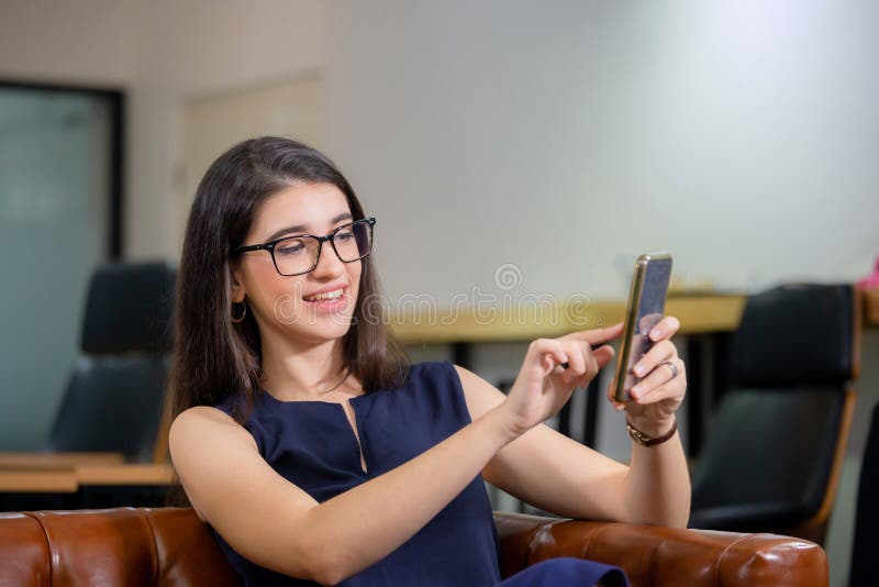 Cheerful Casual Woman Taking Selfie Relaxing In Modern Office Stock