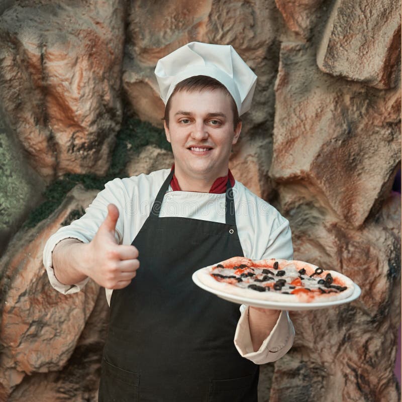Chef Holds a Big Pizza and Shows a Thumb U Stock Photo - Image of cafe ...