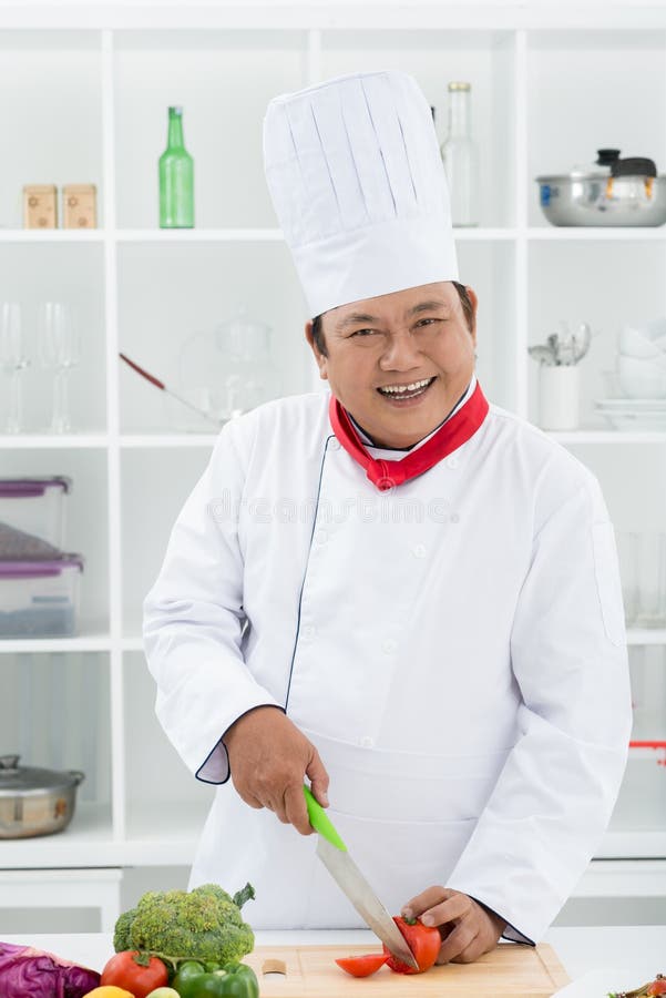 Cheerful chief cook stock image. Image of holding, kitchen - 32194509