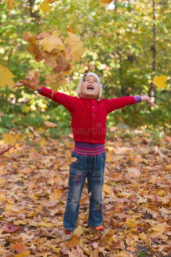 A Small Child Holds A Leaflet And Studies It Stock Image - Image of ...