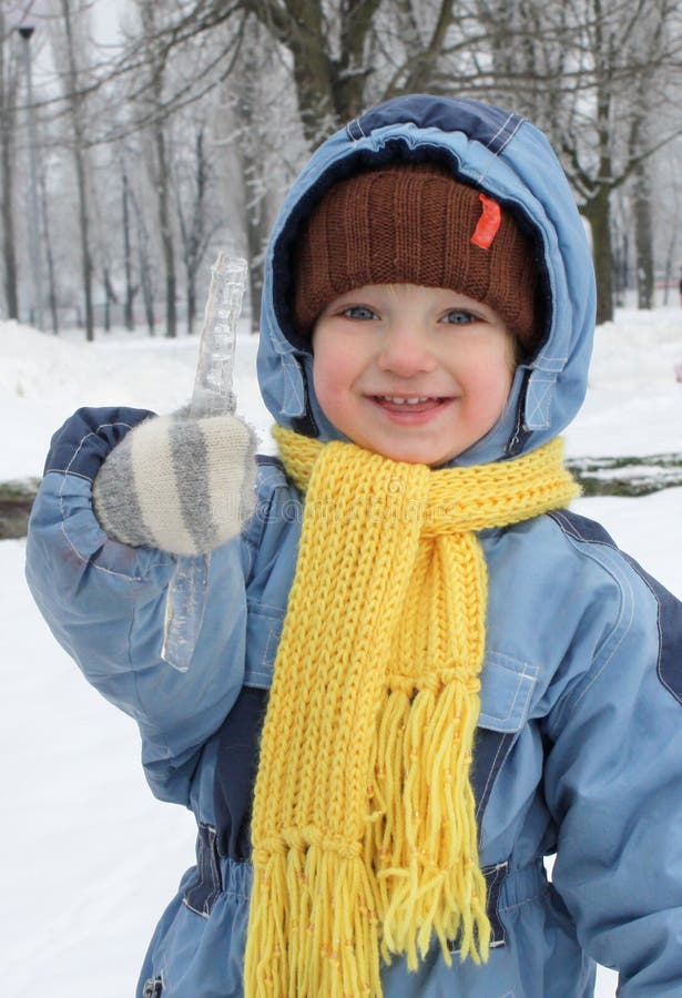 Cheerful Child Keeps Icicle Stock Image - Image of holding, cheerful ...