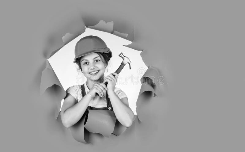 Cheerful Child Laborer Using Building Uniform and Hammer, Copy Space ...