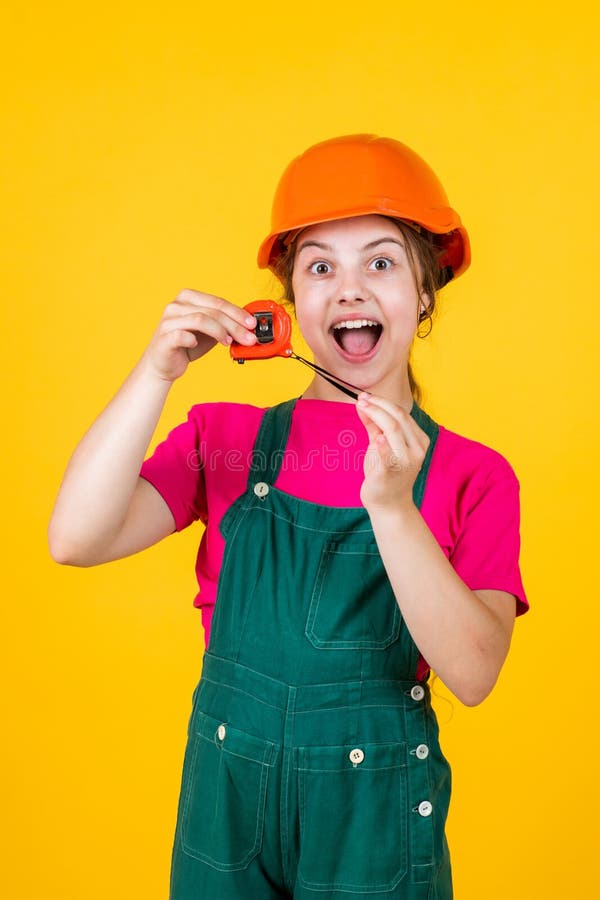 Cheerful Child Laborer Using Building Uniform and Tape Measure Tool ...