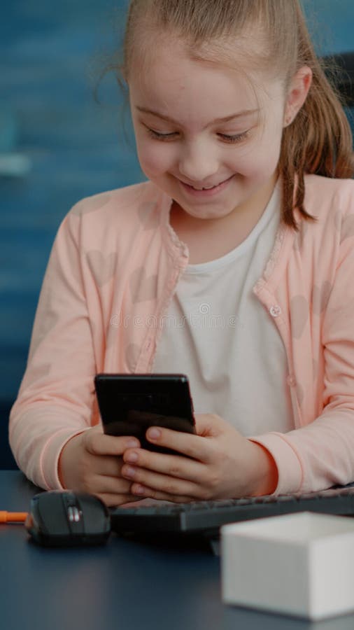 Cheerful Child Looking at Smartphone with Touch Screen Stock Image ...