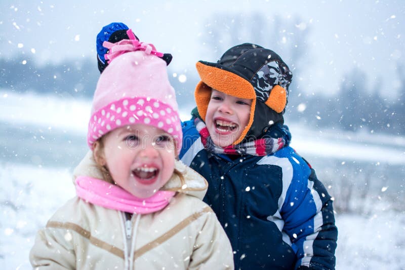 Cheerful Children Playing Together on Snowy Winter Day. Stock Image ...