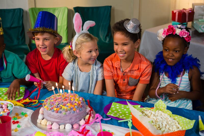 Cheerful children at table stock photo. Image of friendship - 97583774