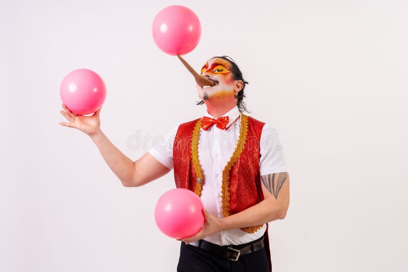 Cheerful Circus Performer Skillfully Juggling a Number of Balls ...