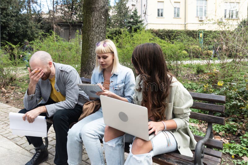 Cheerful Classmates University Students Sitting on a Bench in Spring ...