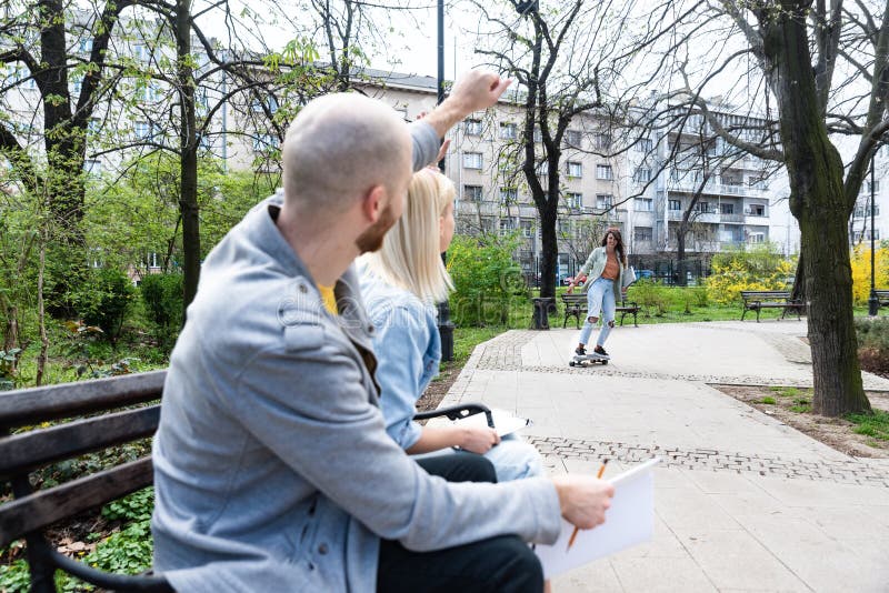 Cheerful Classmates University Students Sitting on a Bench in Spring ...