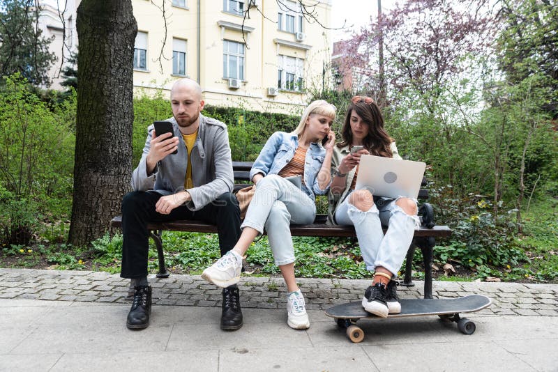 Cheerful Classmates University Students Sitting on a Bench in Spring ...