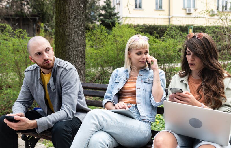 Cheerful Classmates University Students Sitting on a Bench in Spring ...