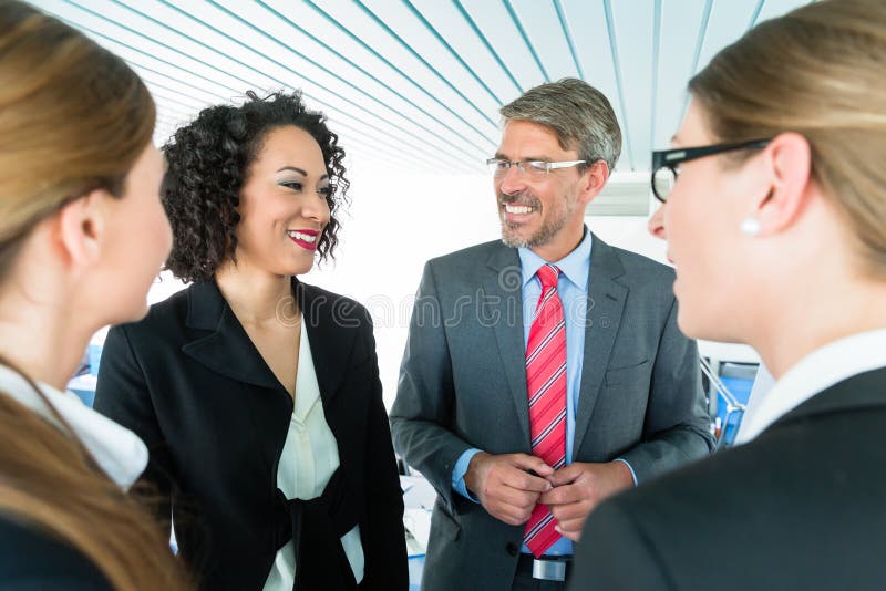 Co-workers Having a Conversation at the Office Stock Photo - Image of ...