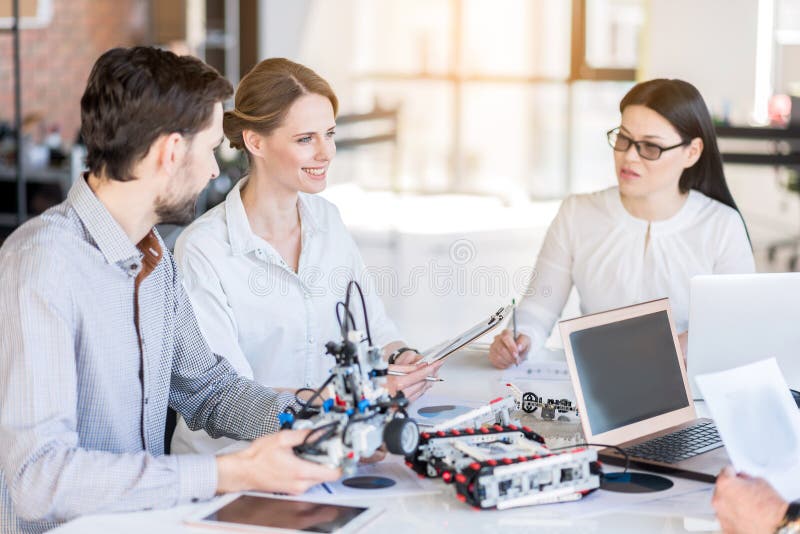 Cheerful Colleagues Creating New Devices Stock Image - Image of gadget ...