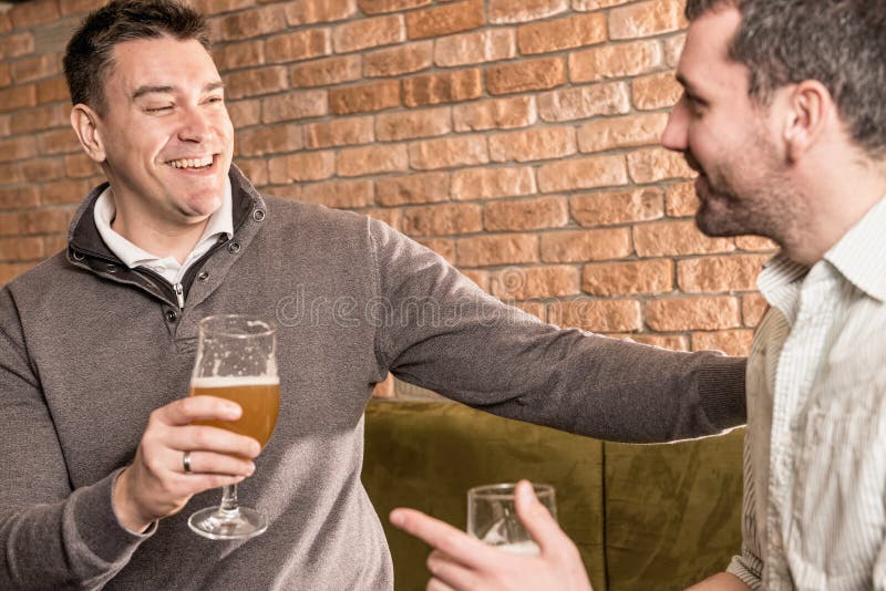 Cheerful Colleagues Drinking Beer after Work Stock Image - Image of ...