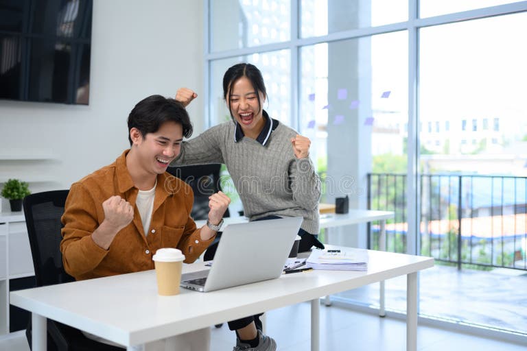 Cheerful Colleagues Expressing Excitement and Success after Completing a Task Stock Photo ...