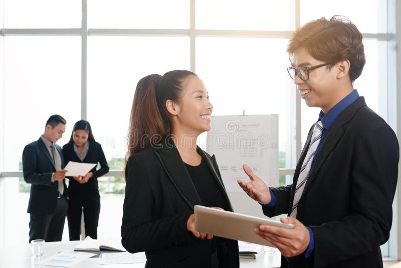 Cheerful Colleagues at Work Stock Image - Image of teamwork, standing ...