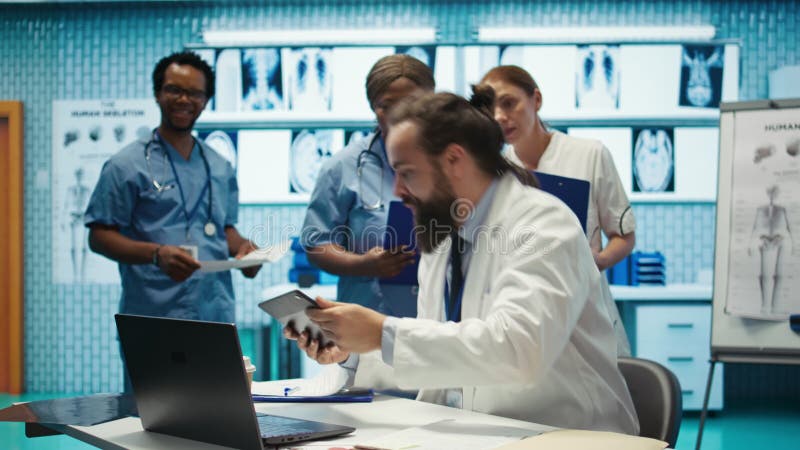 Cheerful Confident Doctors and Nurses Finding Right Treatment Plan for ...