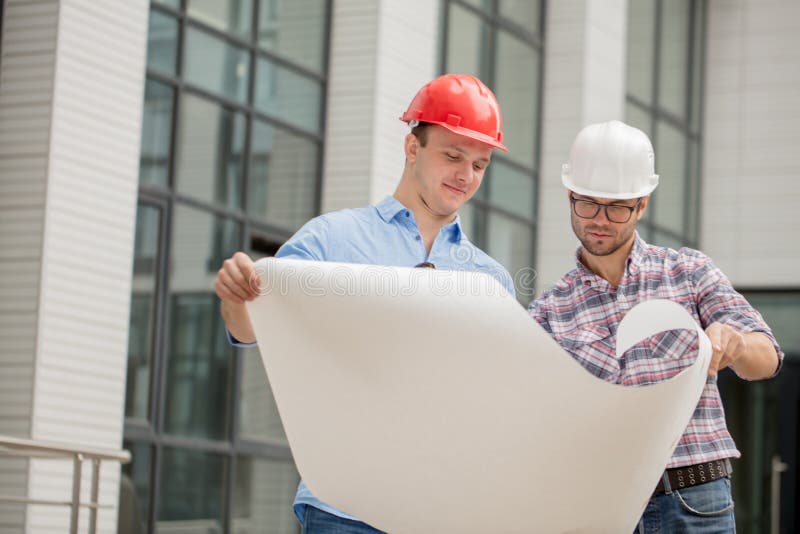 Cheerful Constructors are Looking at the Finished Project Stock Photo ...