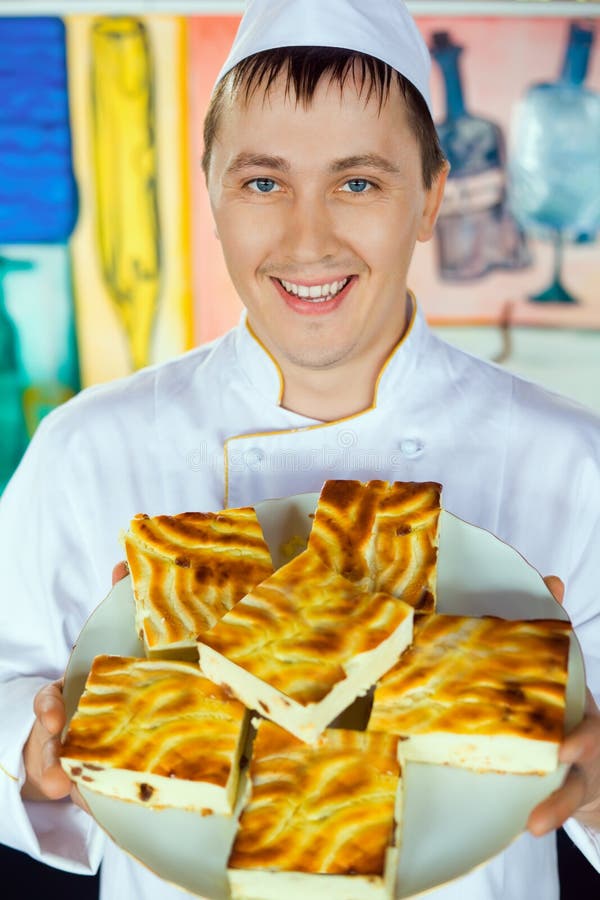 Cheerful Cook Holding Cheese Baked Pudding on Dish Stock Photo - Image ...