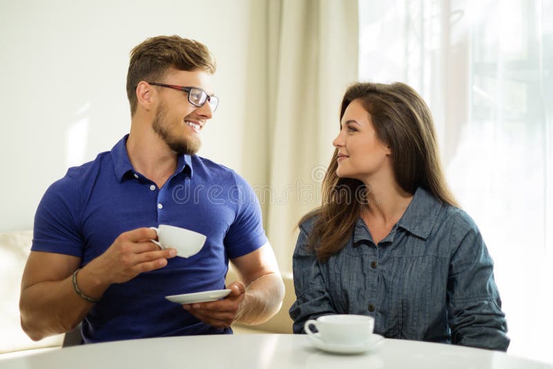 Cheerful Couple Behind Table Stock Photo - Image of people, friends ...