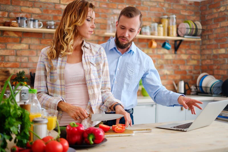 Cheerful Couple Cooking on Modern Kitchen Stock Photo - Image of modern ...
