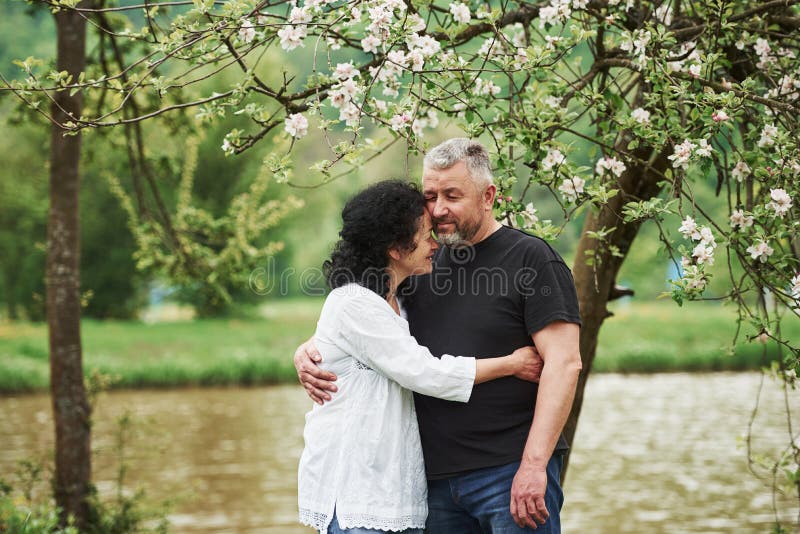 Cheerful Couple Enjoying Nice Weekend Outdoors. Good Spring Weather ... Cheerful Couple Enjoying Nice Weekend Outdoors. Good Spring Weather ...