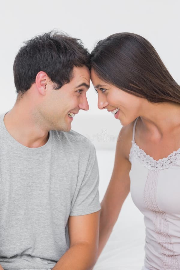 Cheerful Couple Facing Each Other Stock Photo - Image of calm, couple ...