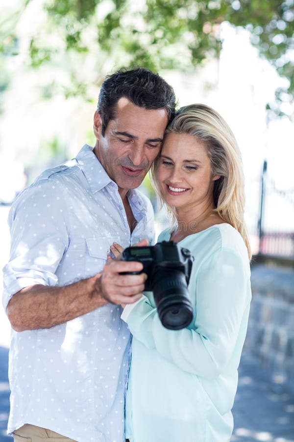 Cheerful Couple Looking in Camera Stock Photo - Image of looking ...