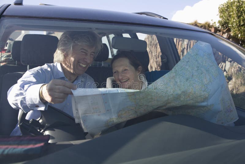 Cheerful Couple with Map in Car Stock Image - Image of enjoyment ...