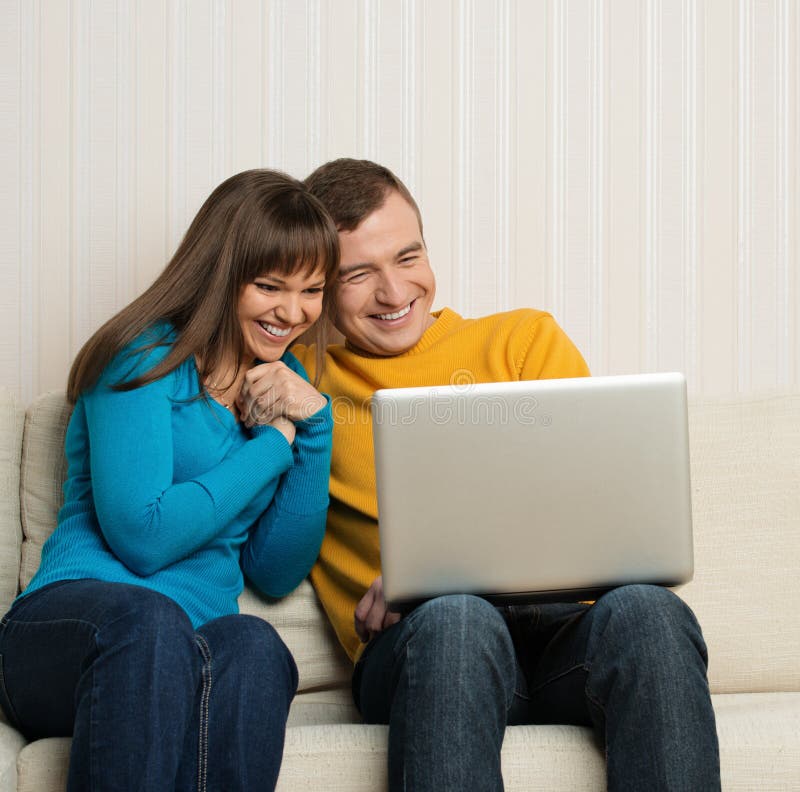 Cheerful Couple with Notebook Stock Photo - Image of leisure, computer ...
