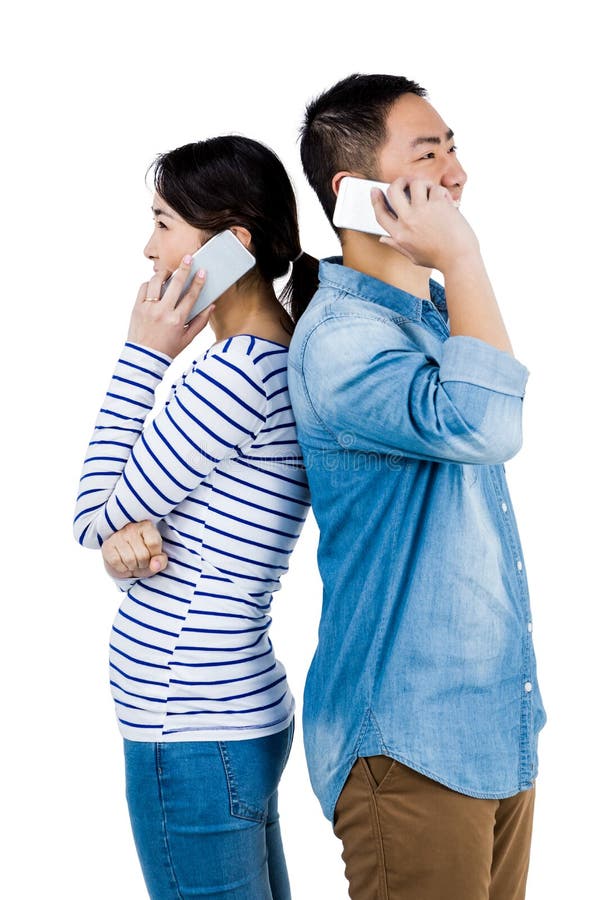 Cheerful Couple Talking on Phone Stock Photo - Image of holding ...