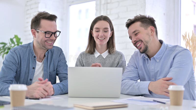 Cheerful Creative Team Doing Video Chat on Laptop Stock Image - Image ...