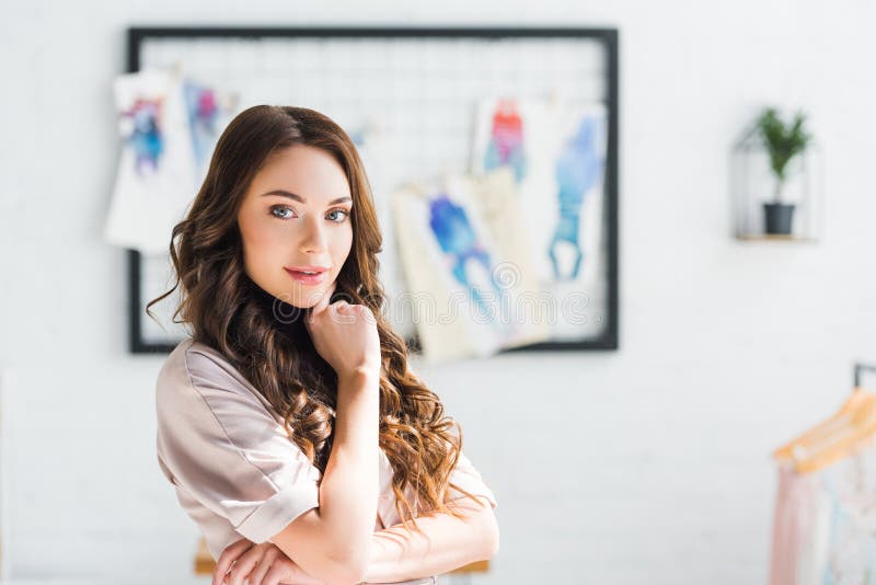 Curly Woman Looking at Camera while Standing at Home Stock Photo ...