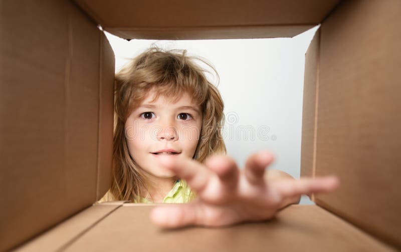 Cheerful Cute Child Opening a Present. View from Inside of the Box ...