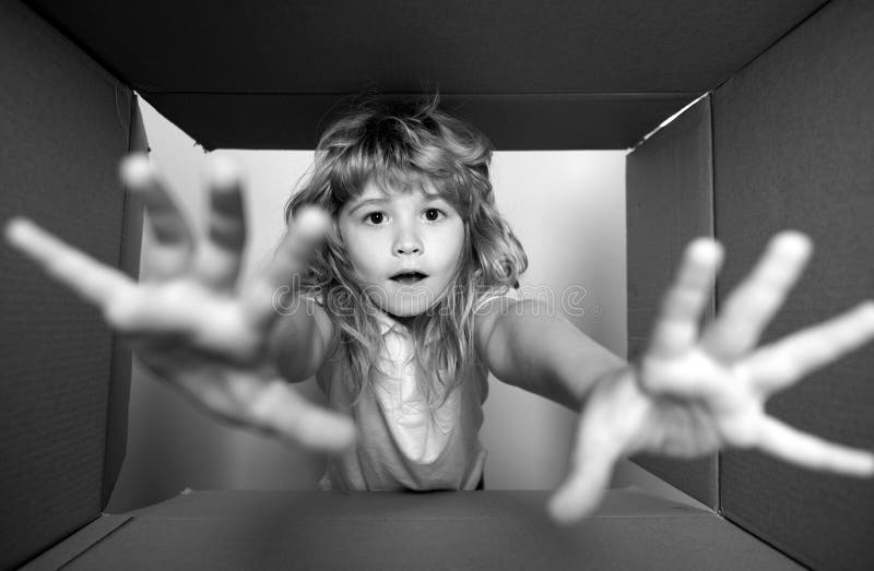 Cheerful Cute Child Opening a Present. View from Inside of the Box Take ...