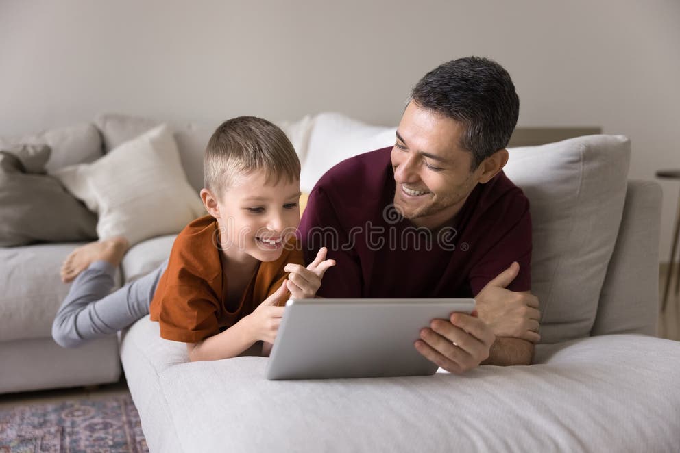 Cheerful Dad and Son Kid Using Internet Technology at Home Stock Image ...