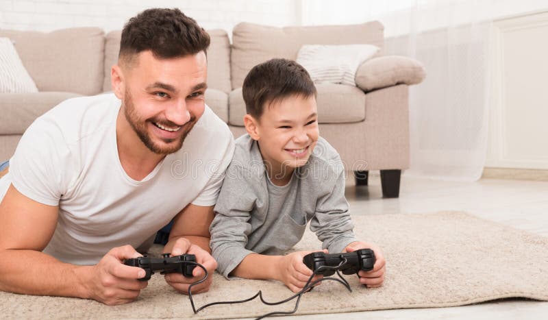 Cheerful Dad and Son Playing Video Games at Home Stock Image - Image of ...