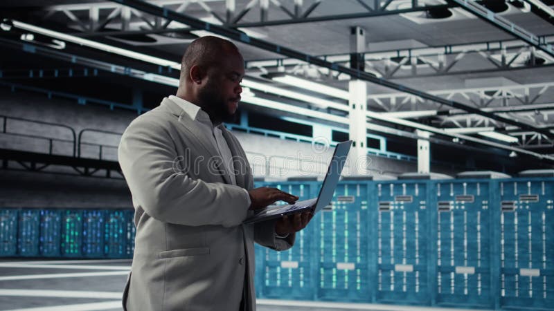 Cheerful Data Center System Administrator Reviews Code for Automation Scripts Stock Video ...