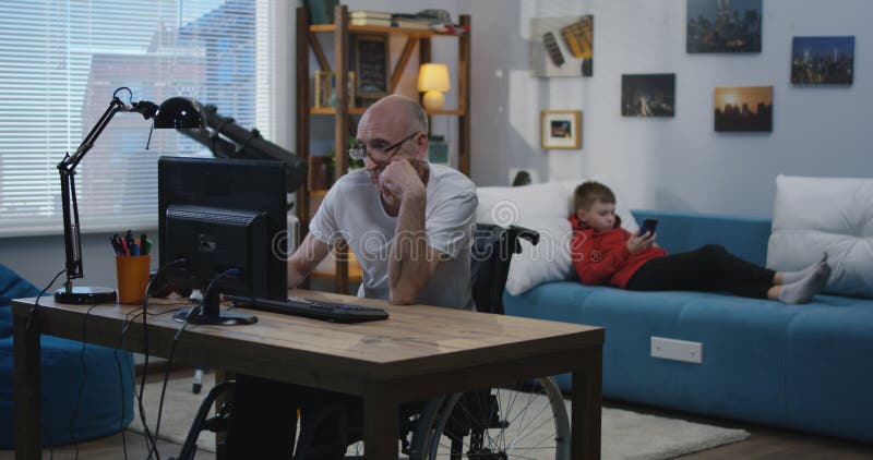 A Cheerful Disable Man on Computer Stock Photo - Image of technology ...