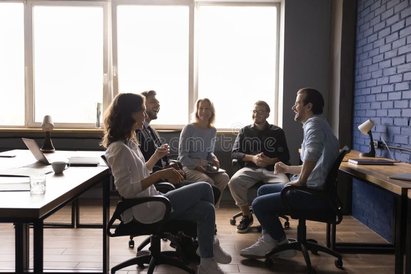 Cheerful Diverse Team Sitting on Chairs in Circle, Brainstorming Stock ...