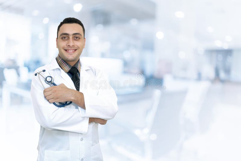 Cheerful Doctor Standing in a Hospital Stock Image - Image of ...