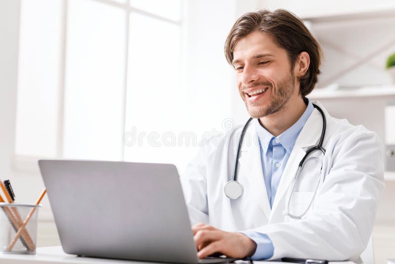 Cheerful Doctor Working on Laptop in Office Stock Image - Image of ...