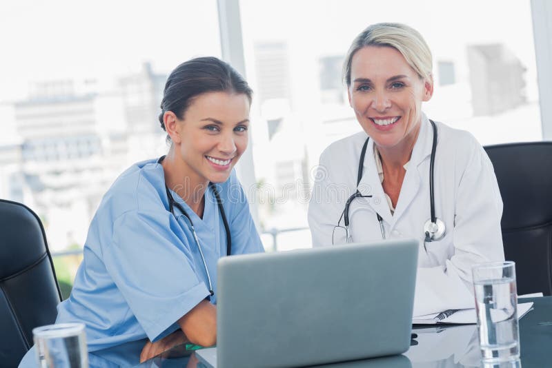 Cheerful Doctors Working Together Stock Image - Image of colleagues ...