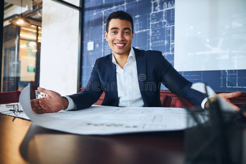 Cheerful Draftsman with a Technical Drawing Looking Ahead Stock Photo ...