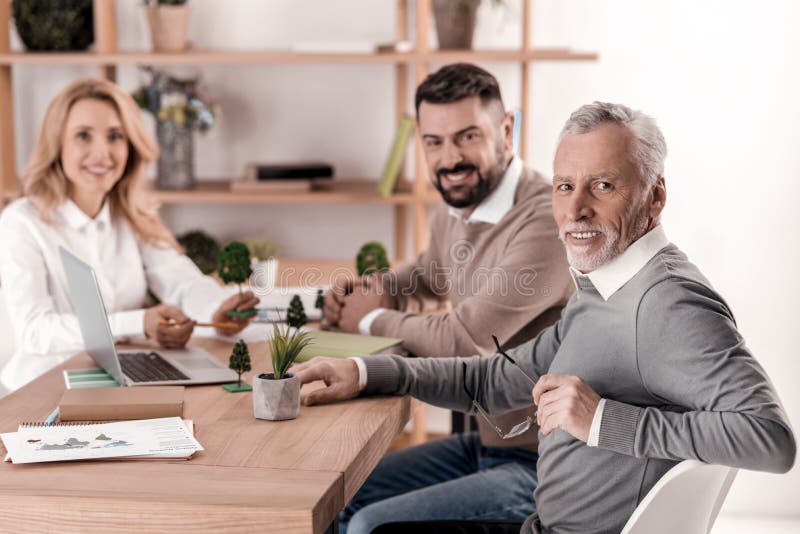 Cheerful Ecologists Sitting at the Table Stock Image - Image of ...