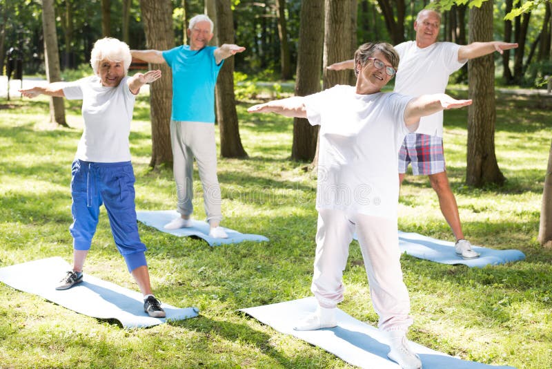 Cheerful Elderly People Doing Yoga Stock Photo - Image of active ...