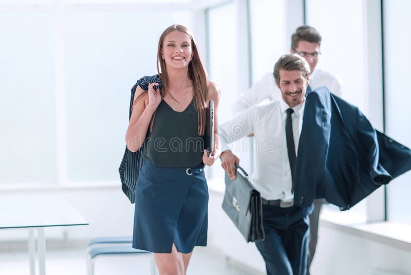 Cheerful Employees Completing Their Work Day at the Office Stock Image ...