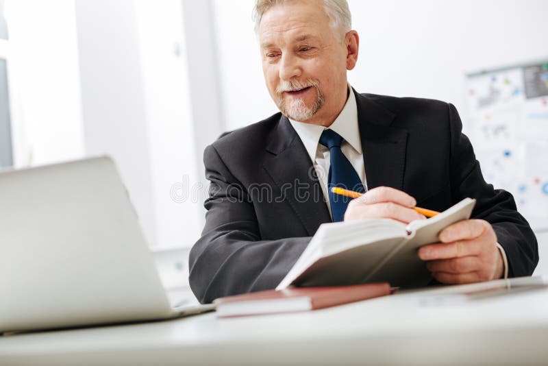 Cheerful Employer Taking Notes at the Workplace Stock Photo - Image of ...