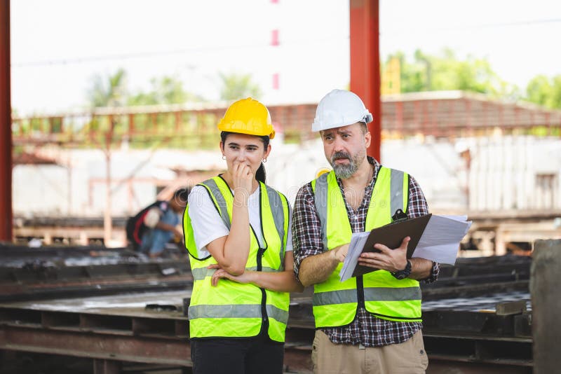 Cheerful Engineer and Female Foreman Worker with Blueprints and Digital ...